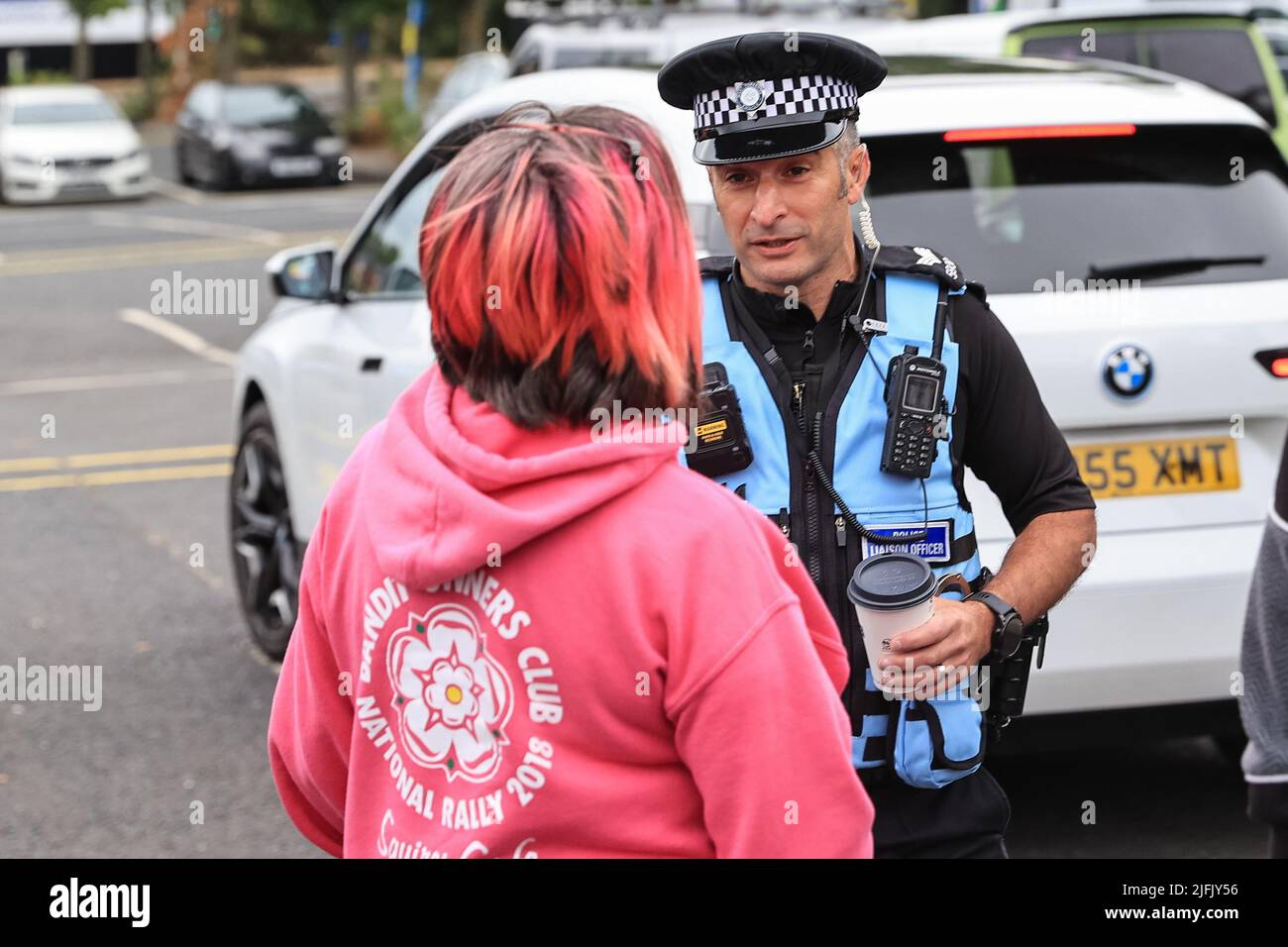 A police liaison officer speaks to a protestor for todays planned ...