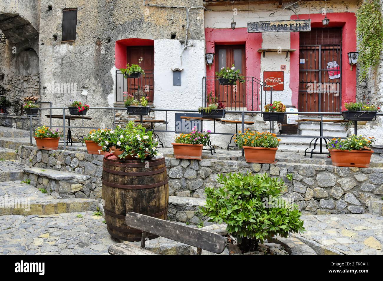 A beautiful shot of a restaurant on a street in Scalea village, the ...