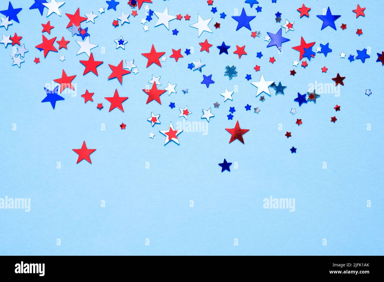 Patriotic USA background with silver, red and blue stars shape sparkles ...