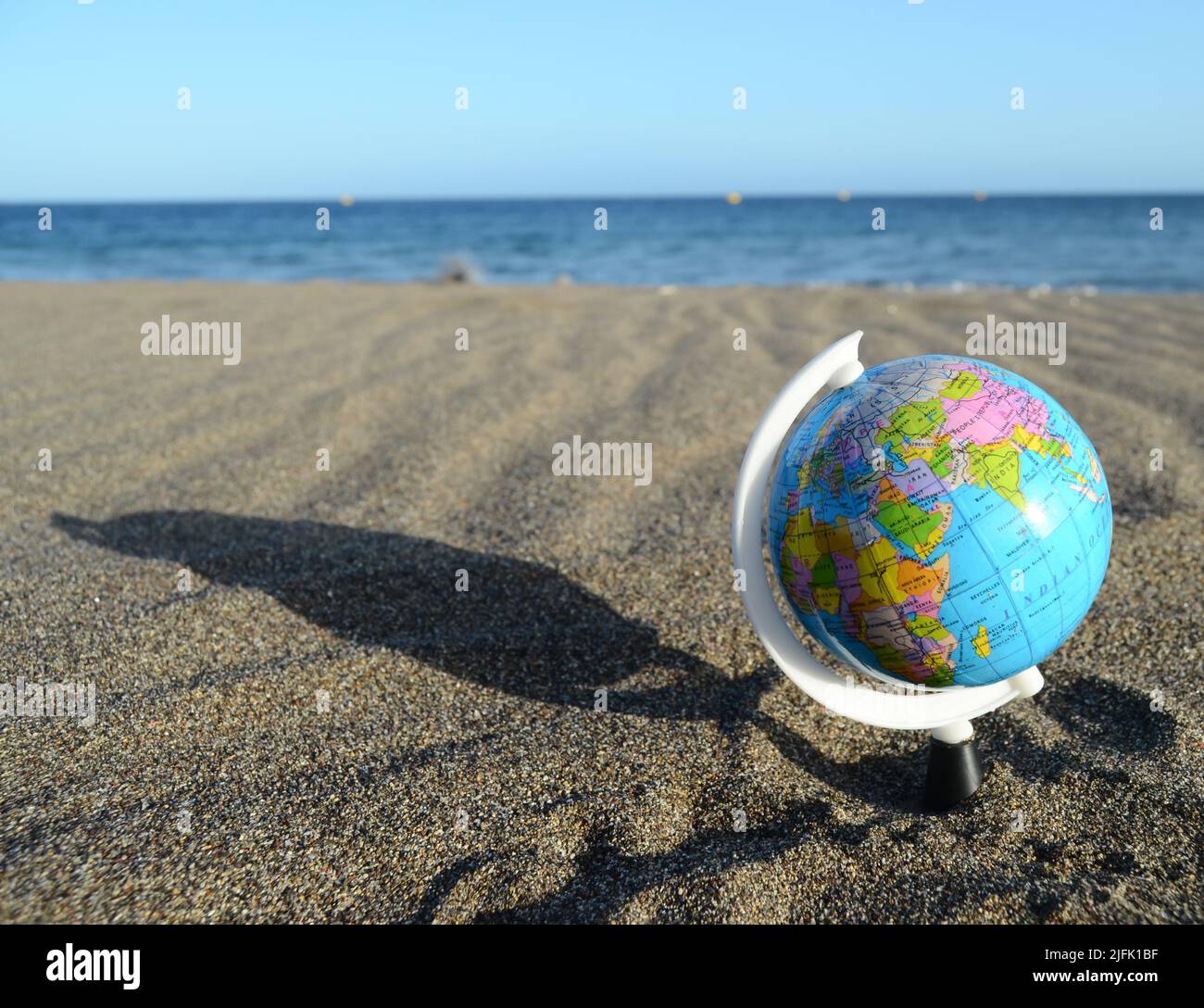 Globe Earth on the Beach near Ocean Stock Photo - Alamy