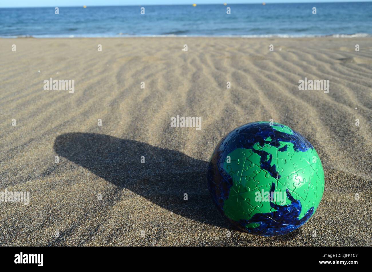 Globe Earth on the Beach near Ocean Stock Photo - Alamy