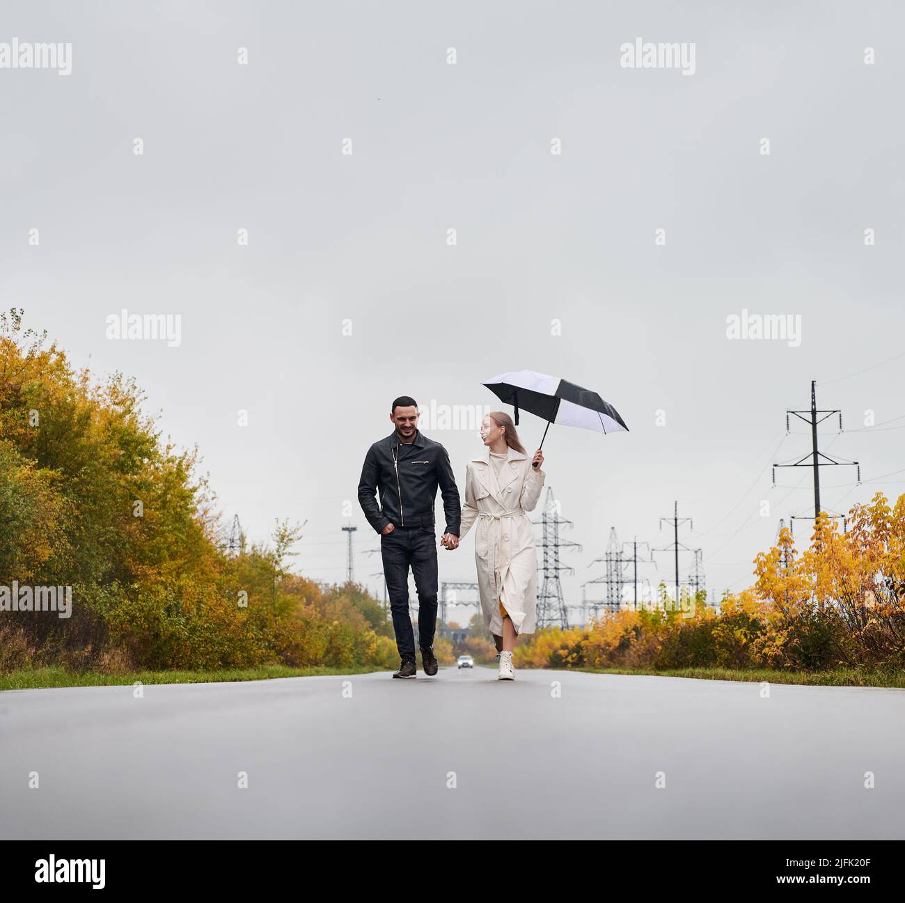 Couples Holding Hands In Rain