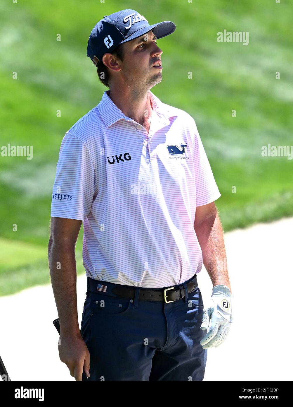 SILVIS, IL - JULY 03: Golfer J.T. Poston checks to see where his ball ...