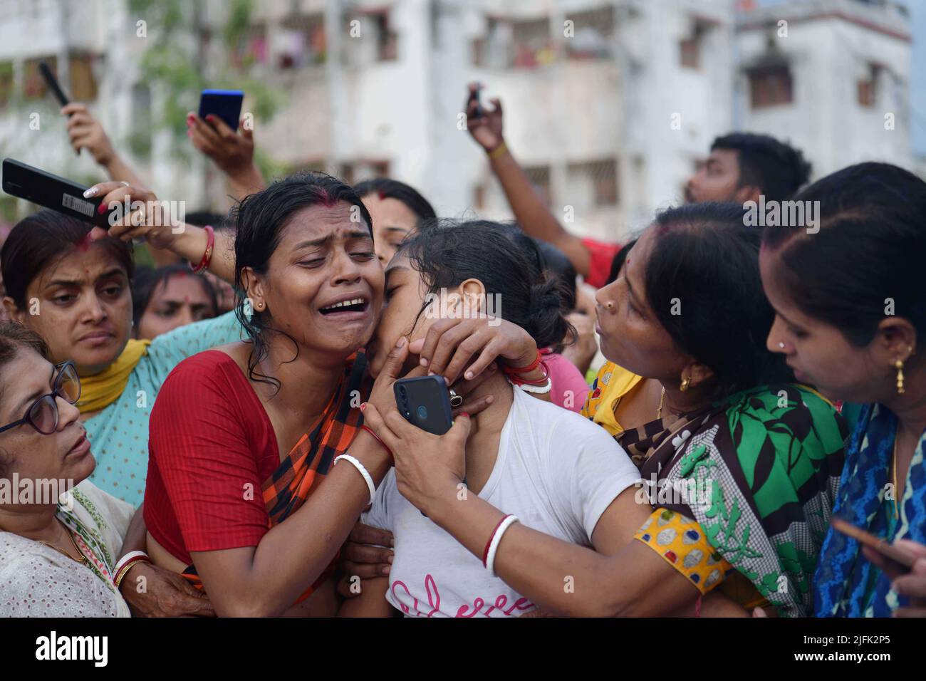 Agartala, India's northeastern state of Tripura. 3rd July, 2022. Family members react after the ...