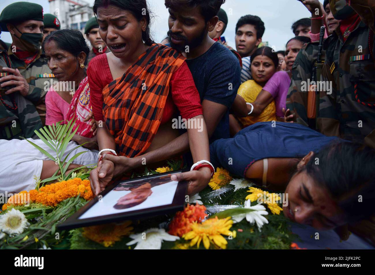 Agartala, India's northeastern state of Tripura. 3rd July, 2022. Family members react after the ...