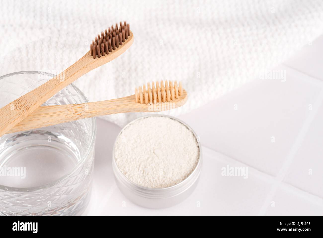 Closeup view of wooden toothbrushes with mineral toothpowder kaolin in ...