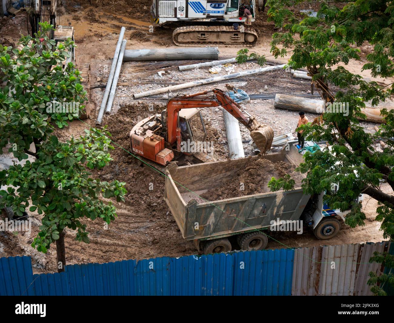 Loading of earth soil in to the body of cargo dump truck at Mumbai ...