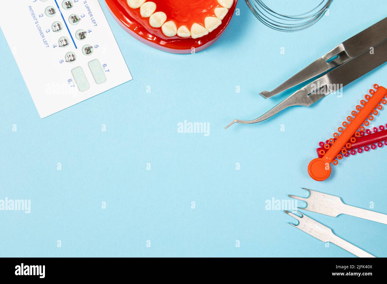 a set of special tools for an orthodontist to install braces for a ...