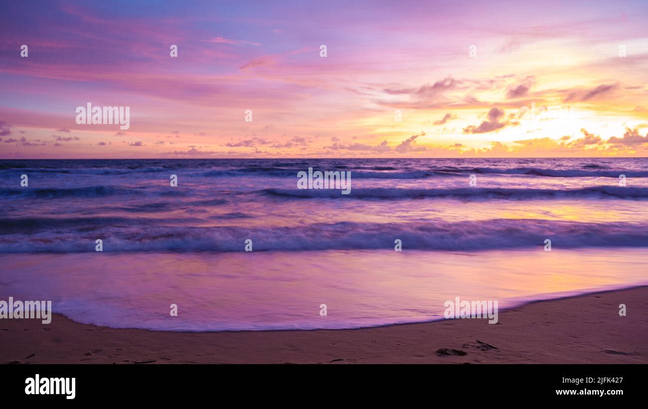 sunset on the beach of Phuket Thailand, colorful sunset during monsoon ...