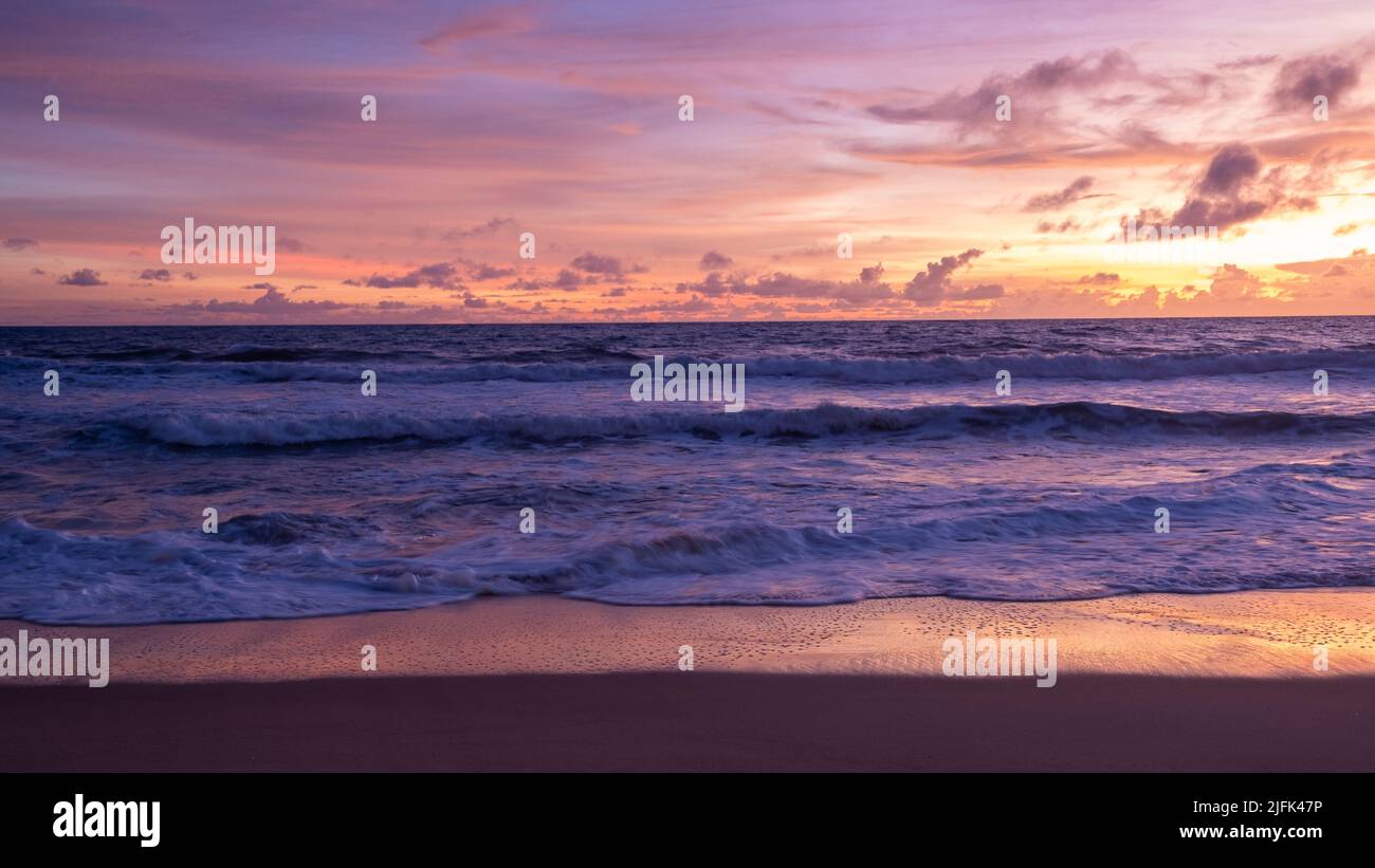 sunset on the beach of Phuket Thailand, colorful sunset during monsoon ...