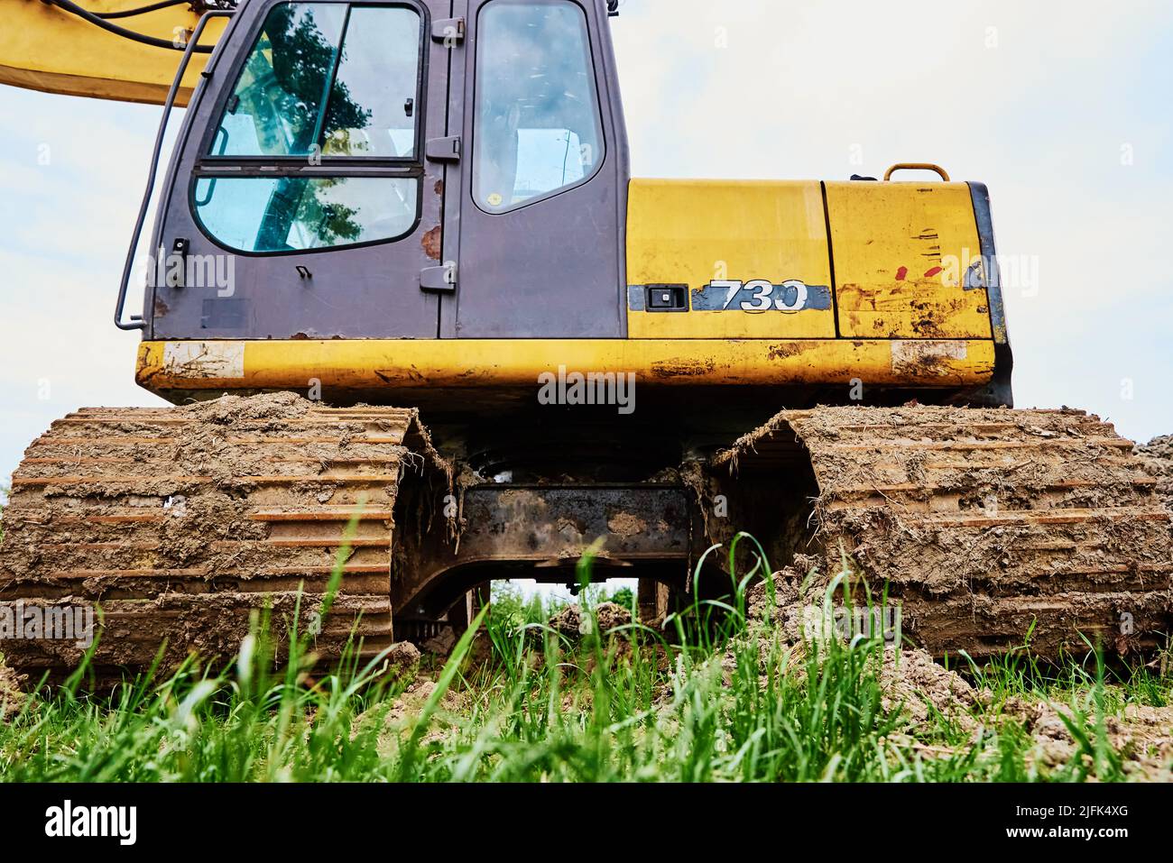 Yellow excavator on construction site, Heavy construction machine ...