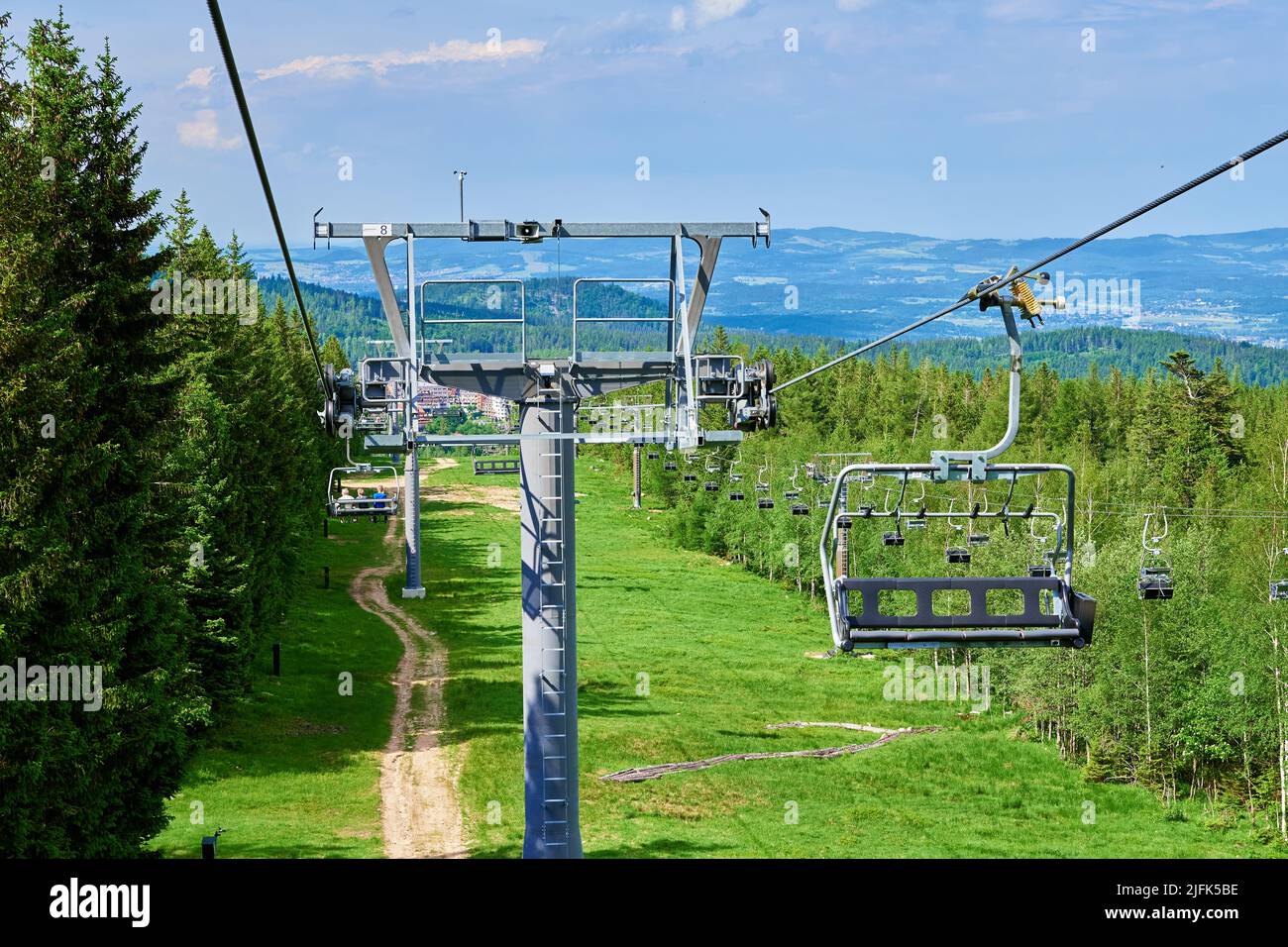 Beautiful mountains, covered with forest and open cable car line ...