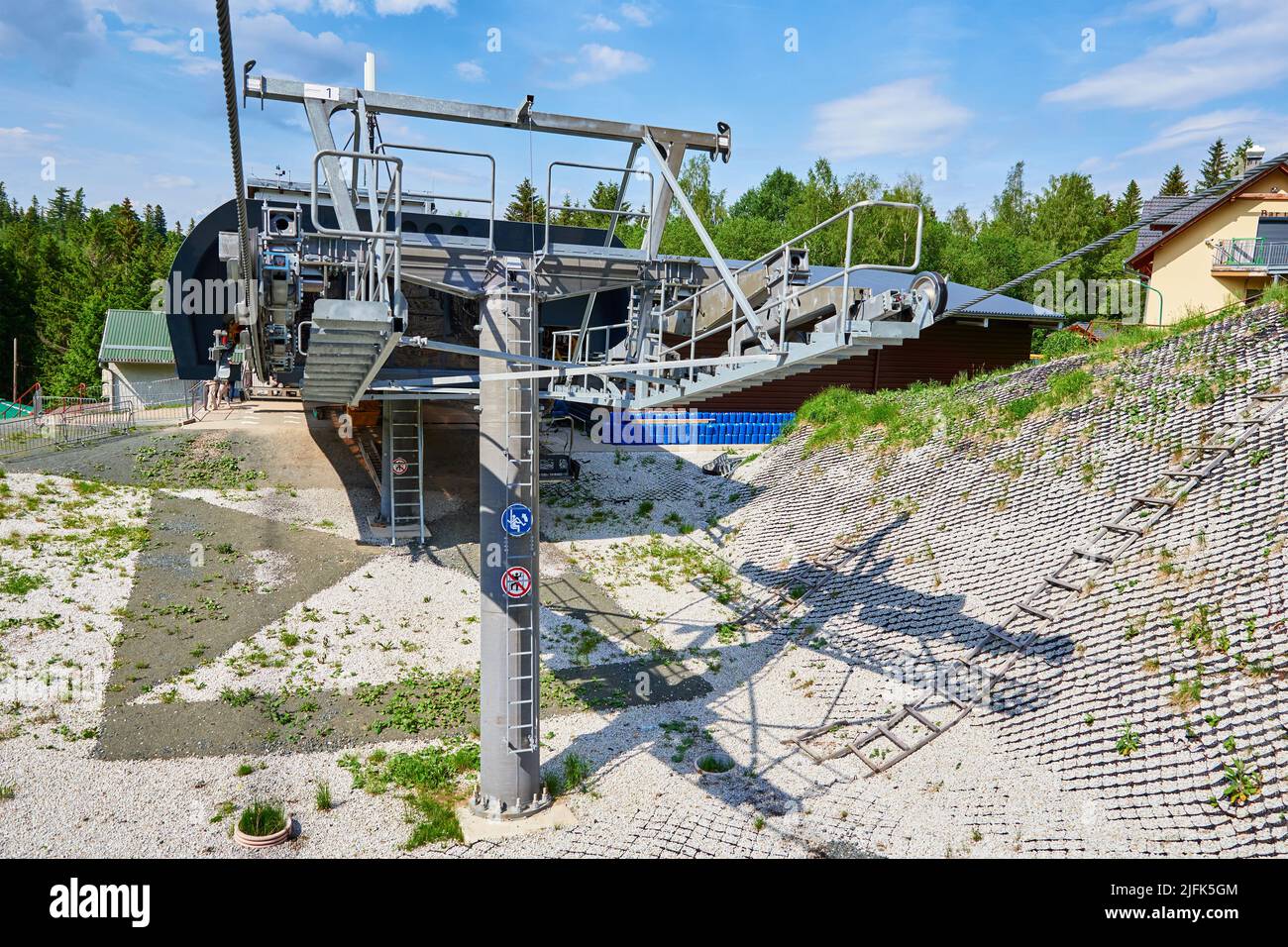 Open cable car line. Metal cable and moving rollers on platform for funicular mechanism, close ...
