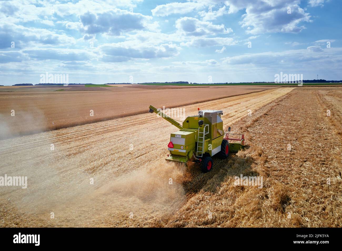 Combine harvester collecting golden wheat field, Harvesting machine ...
