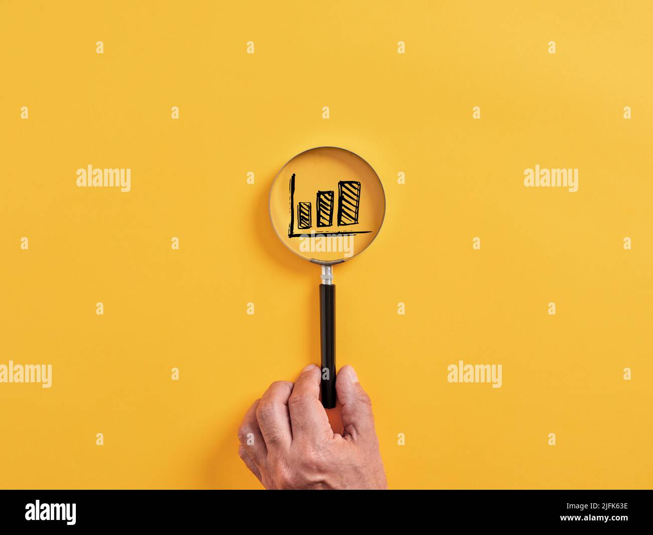 Magnifying glass focusing on graph hi-res stock photography and images ...