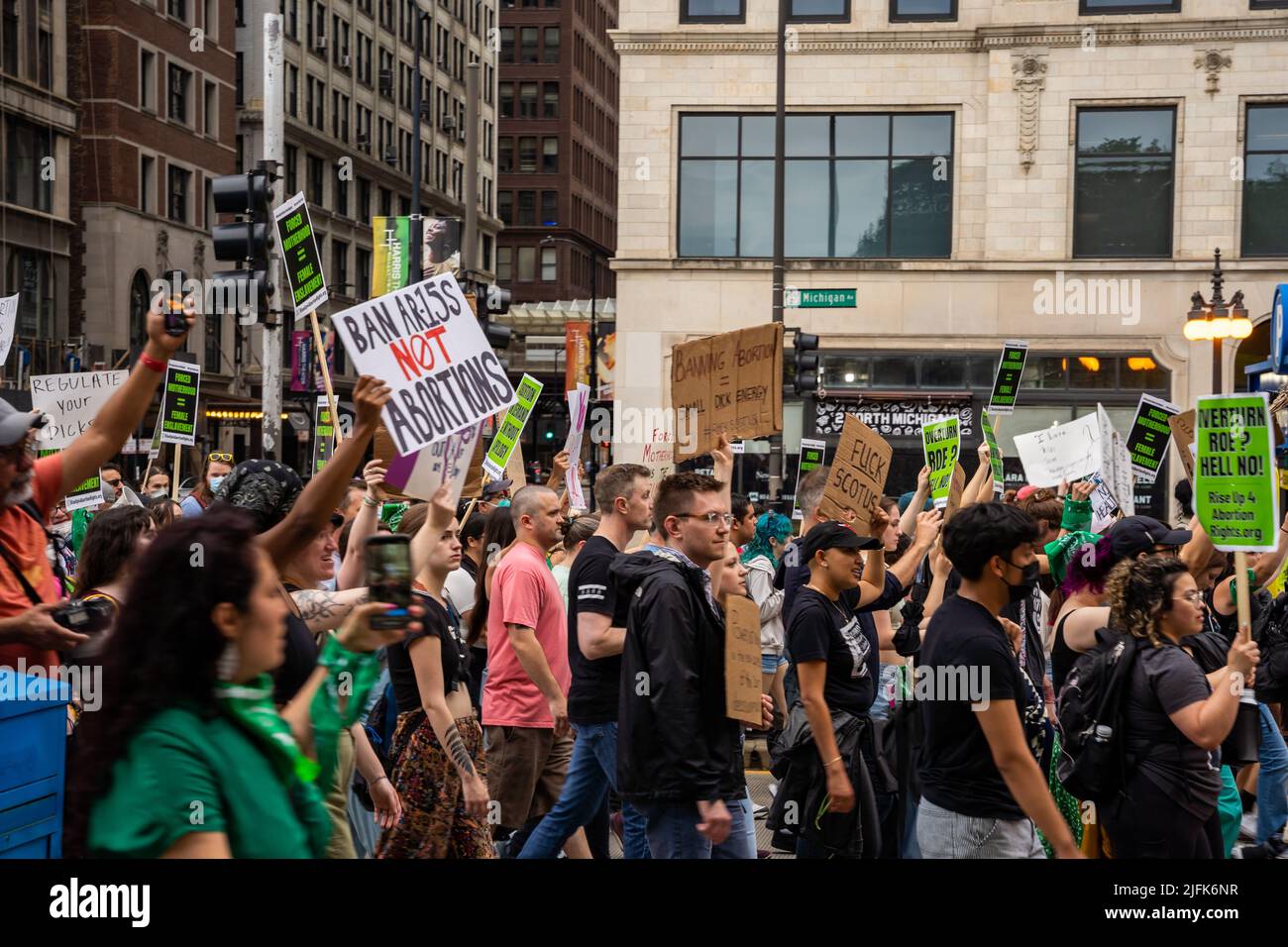 Protesters holding signs My Body My Choice, Ban bombs not Bodies ...