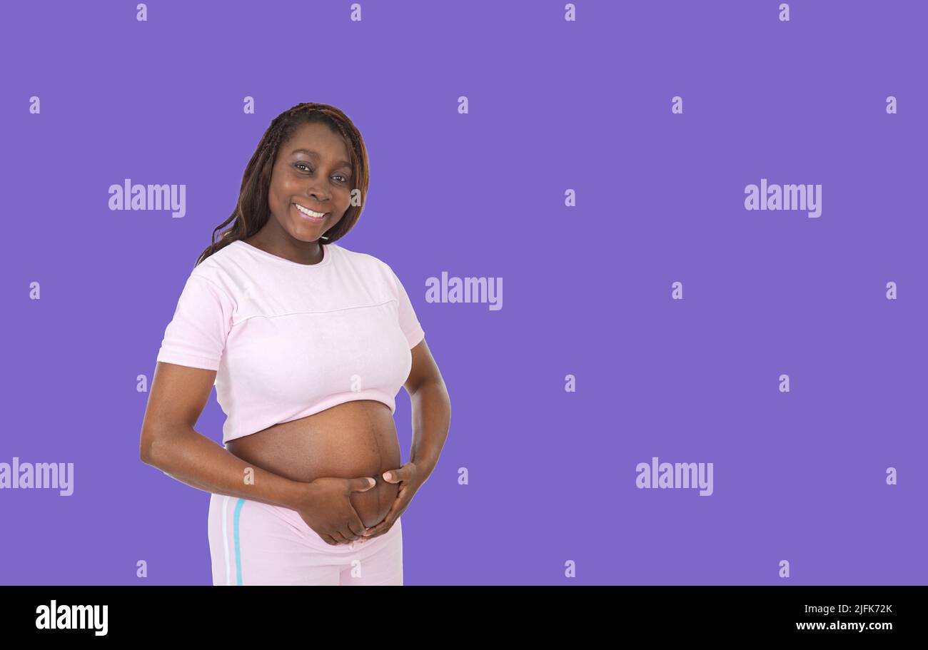 Young beautiful pregnant african woman , over a color background Stock ...