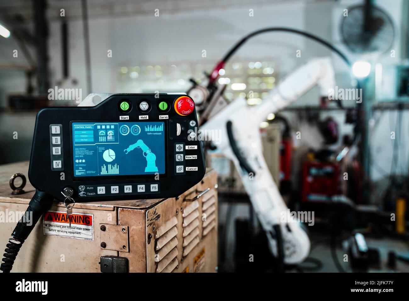 Robotic arm and its controller adept panel in a factory workshop ...