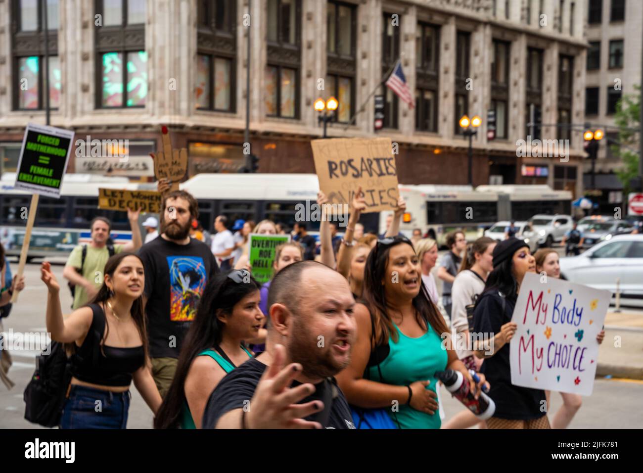 Protesters holding signs My Body My Choice, Ban bombs not Bodies ...