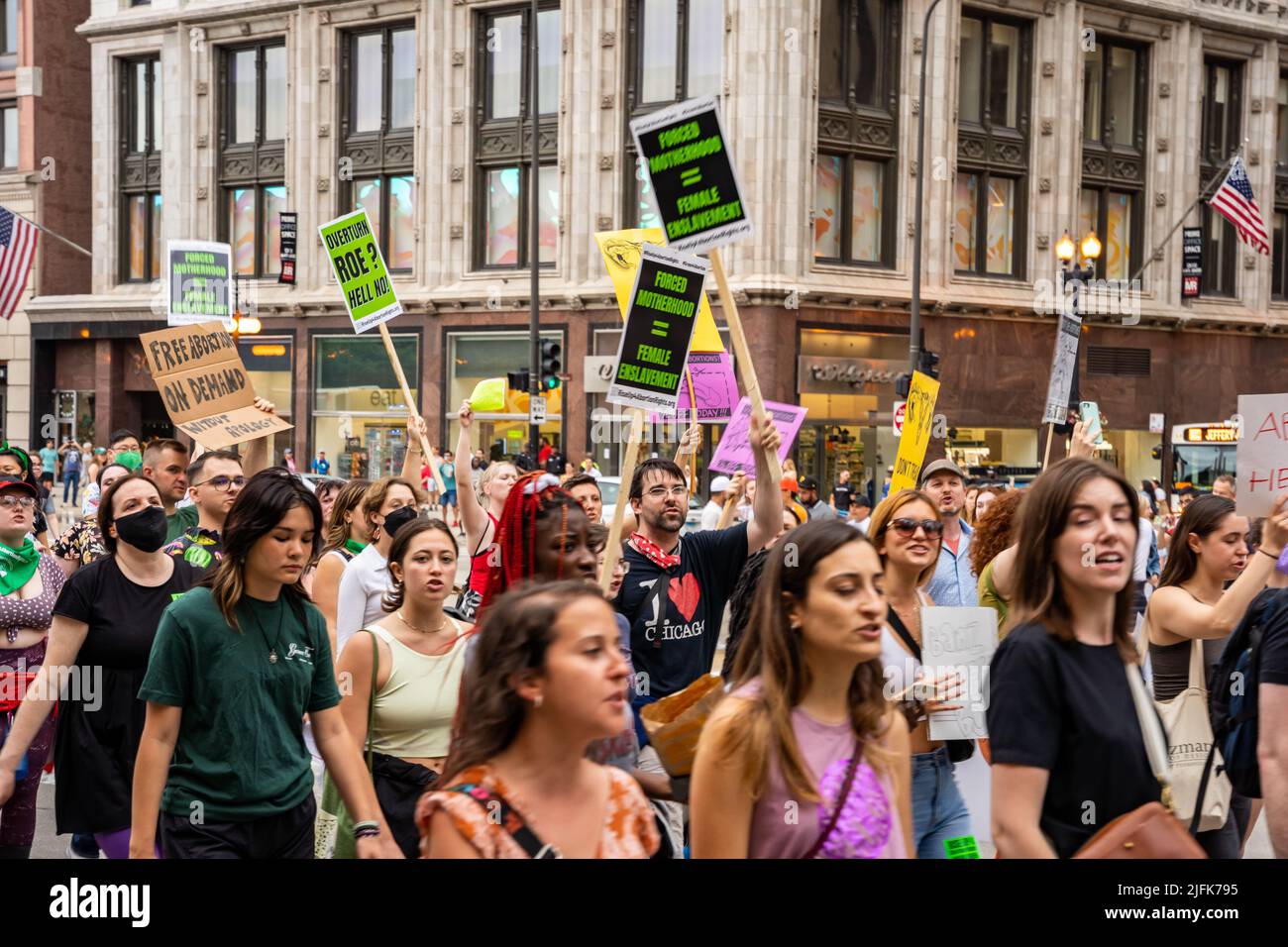 Protesters holding signs My Body My Choice, Ban bombs not Bodies ...