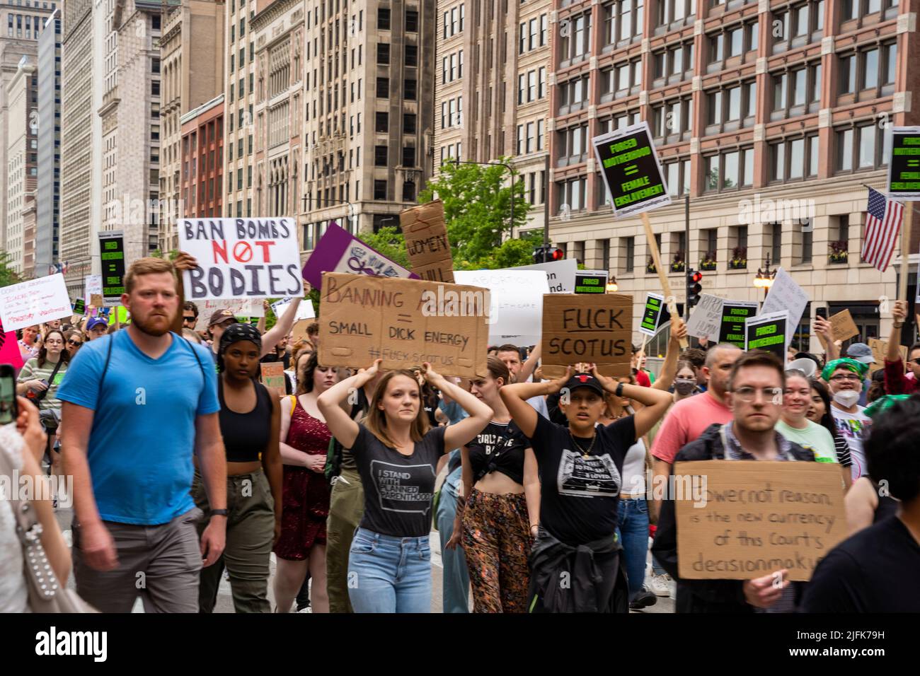 Protesters holding signs My Body My Choice, Ban bombs not Bodies ...