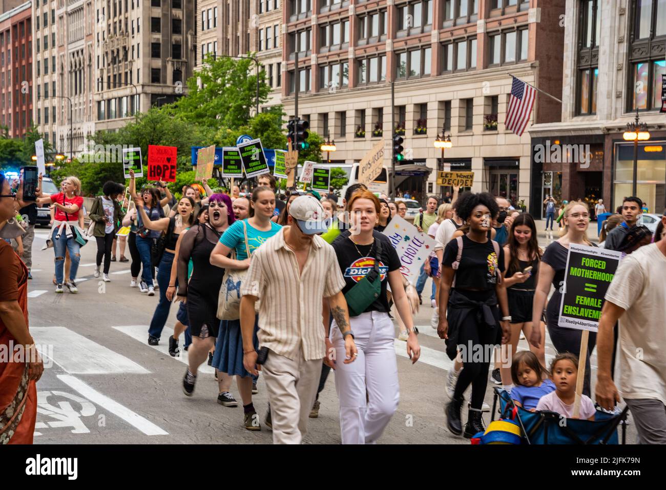 Protesters holding signs My Body My Choice, Ban bombs not Bodies ...