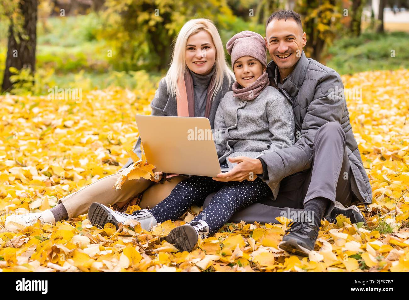 Online communication. Family using laptop and video calling , sitting ...