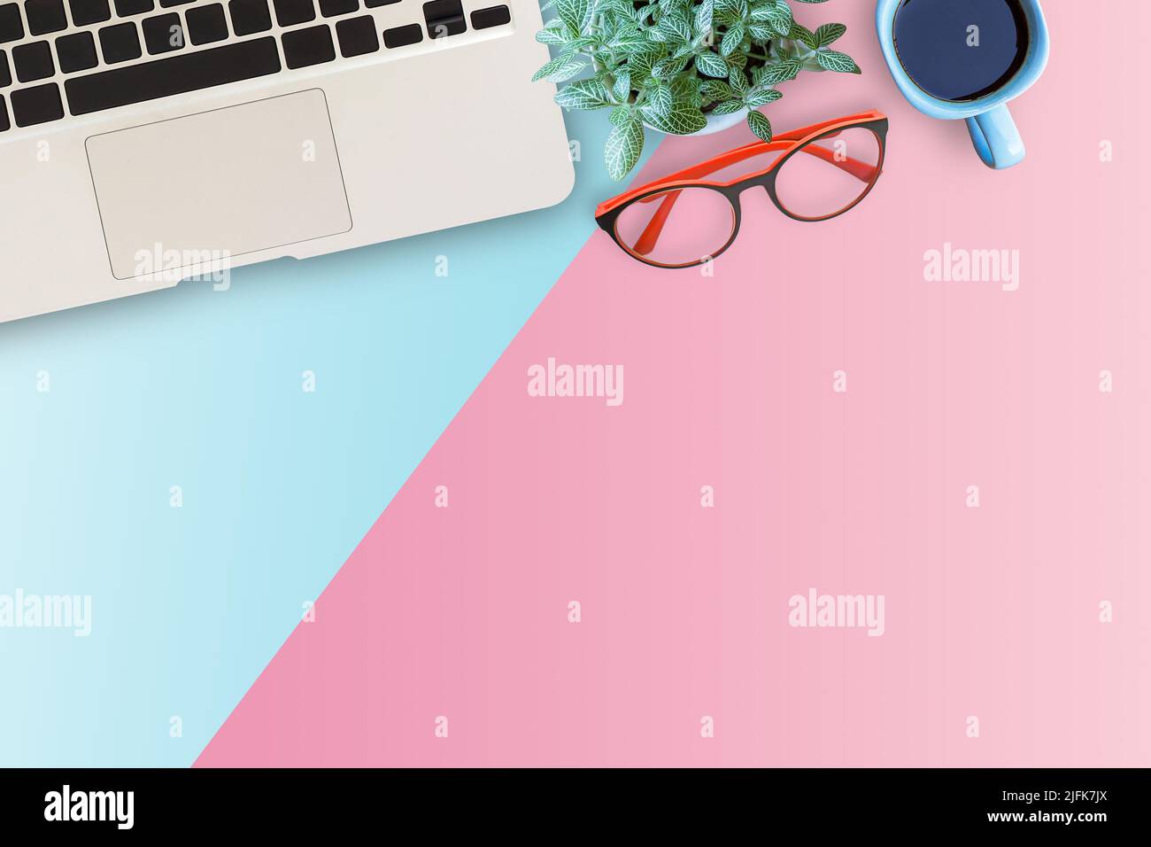 Minimal workspace with Laptop, glasses,flower and smartphone copy space ...