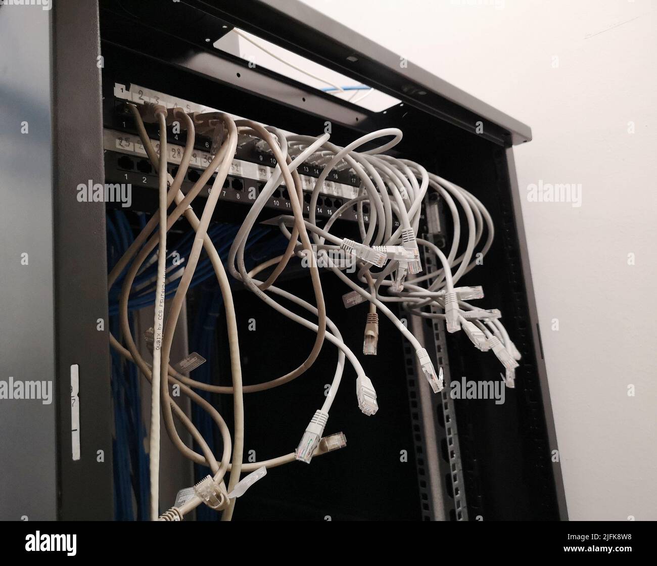 A router and cable installation in the cabinet Stock Photo - Alamy