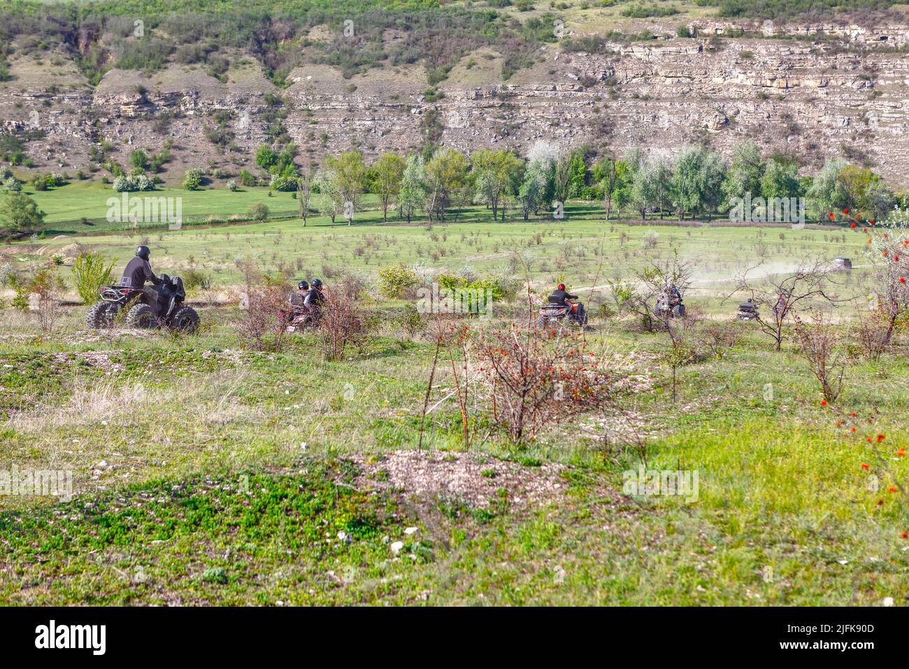 Off road ATV racing . Nature driving on quad bike Stock Photo - Alamy