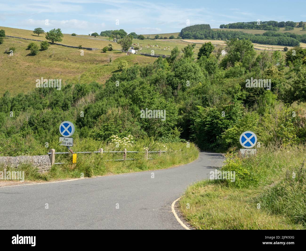 Wooded road descending from Monsal Head into Monsal Dale, Peak District ...