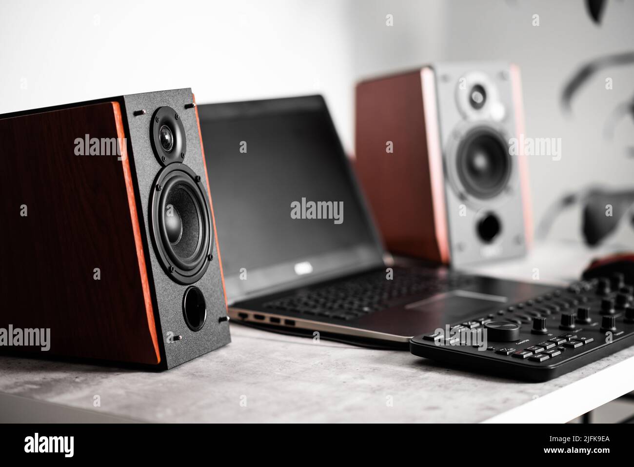 Workstation with speakers and computer in studio. Desktop in home ...