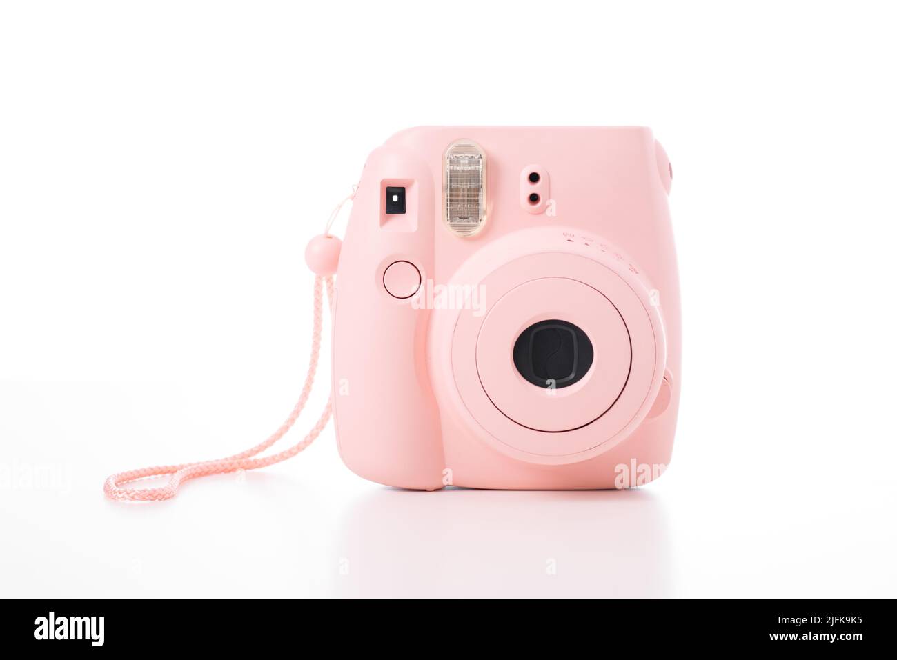 The pink instant camera over white background Stock Photo - Alamy