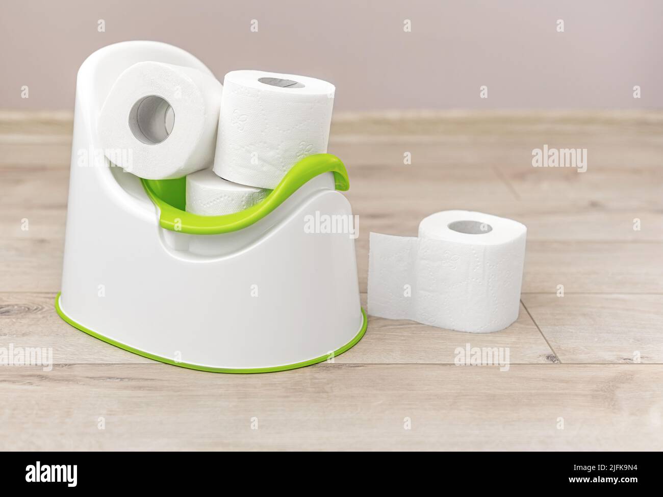 Baby potty and toilet paper Stock Photo - Alamy