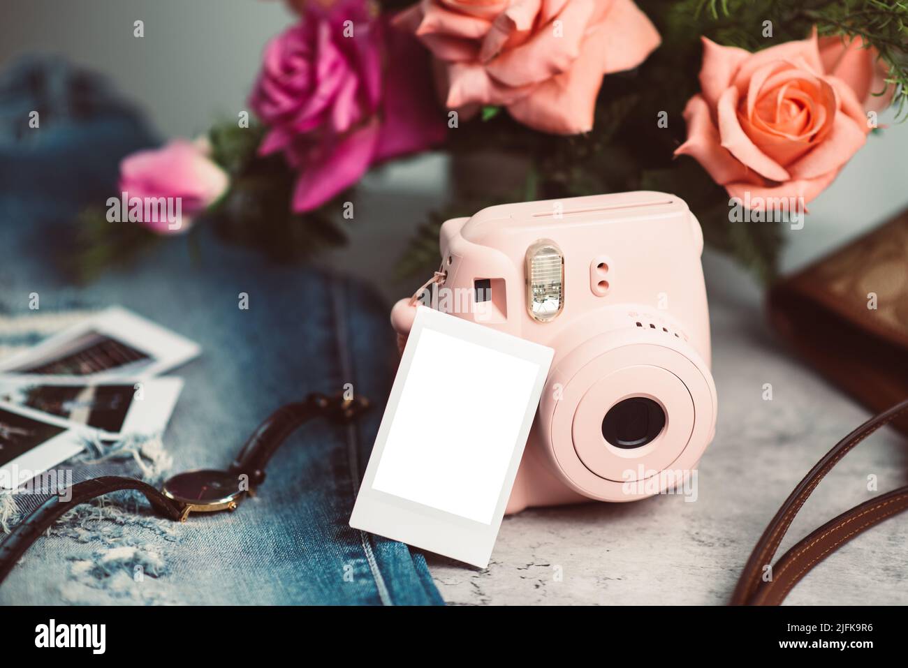 The pink instant camera with blank instant films Stock Photo - Alamy