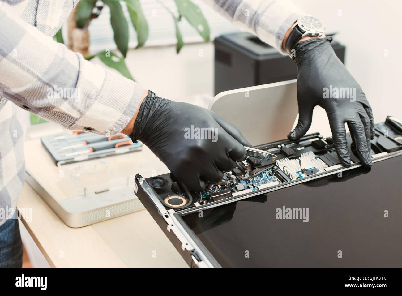 Technician reparing a broken computer. Computer service and repair ...