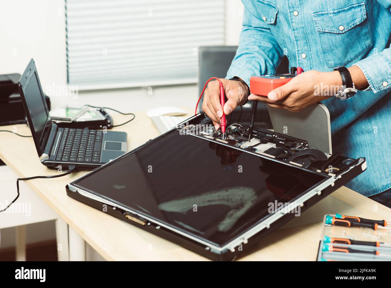 Technician reparing a broken computer. Computer service and repair ...