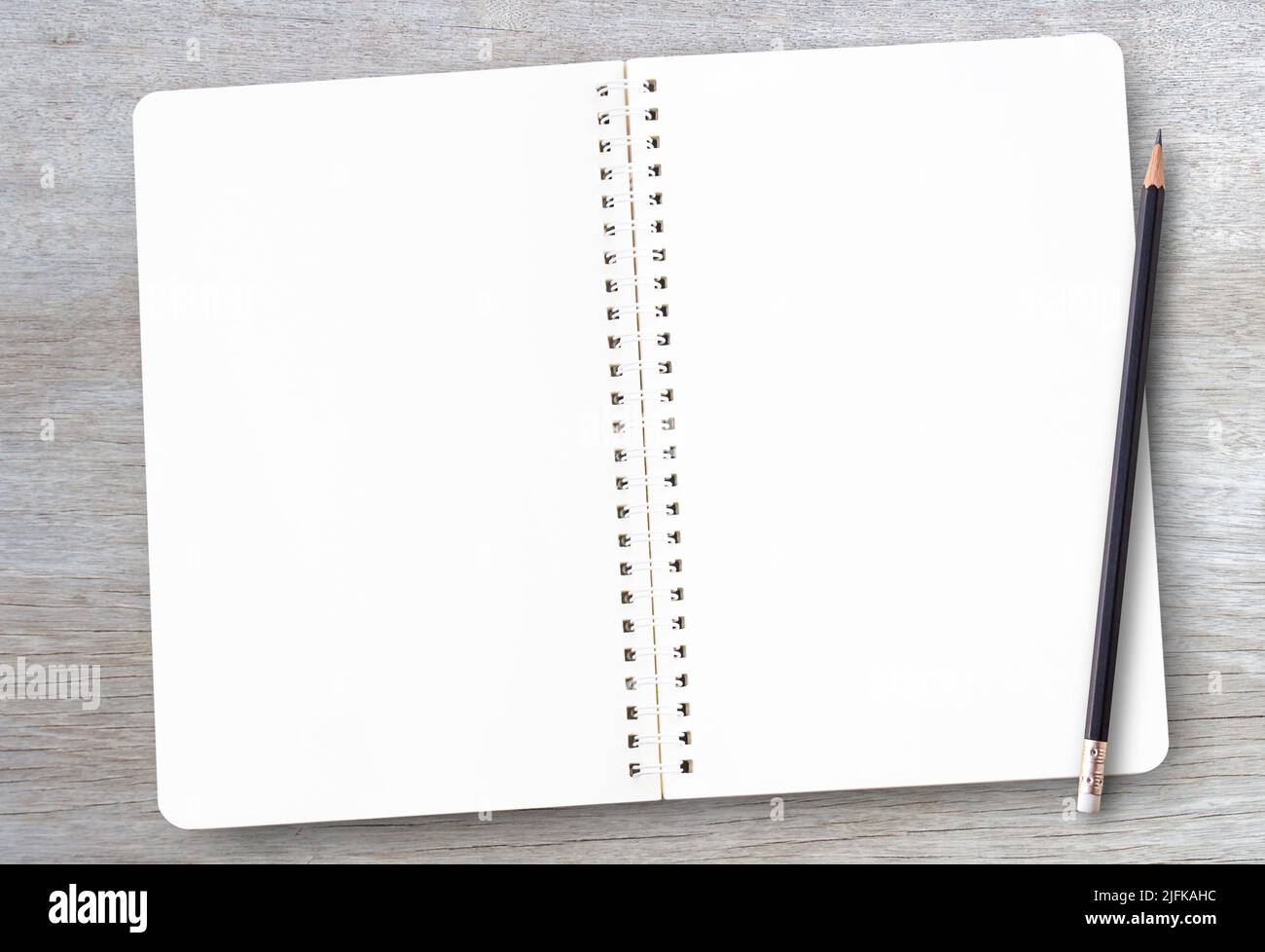 Notepad or notebook with pencil on brown wood table background.using ...