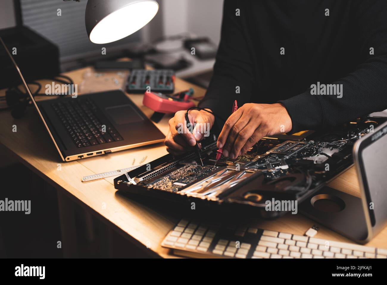 Technician reparing a broken computer. Computer service and repair ...