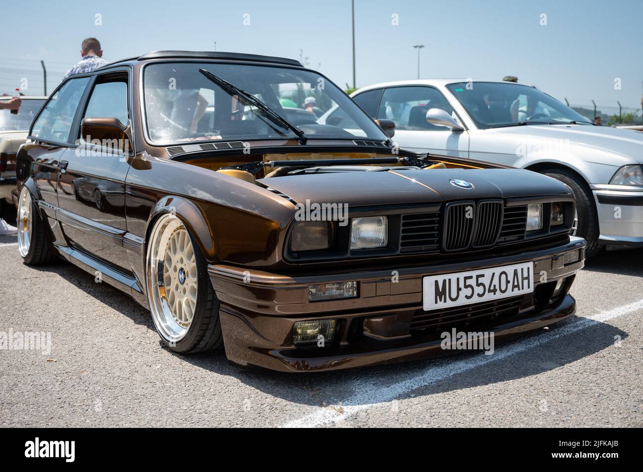 beautiful brown BMW E30 with square headlights and an open hood. stance ...