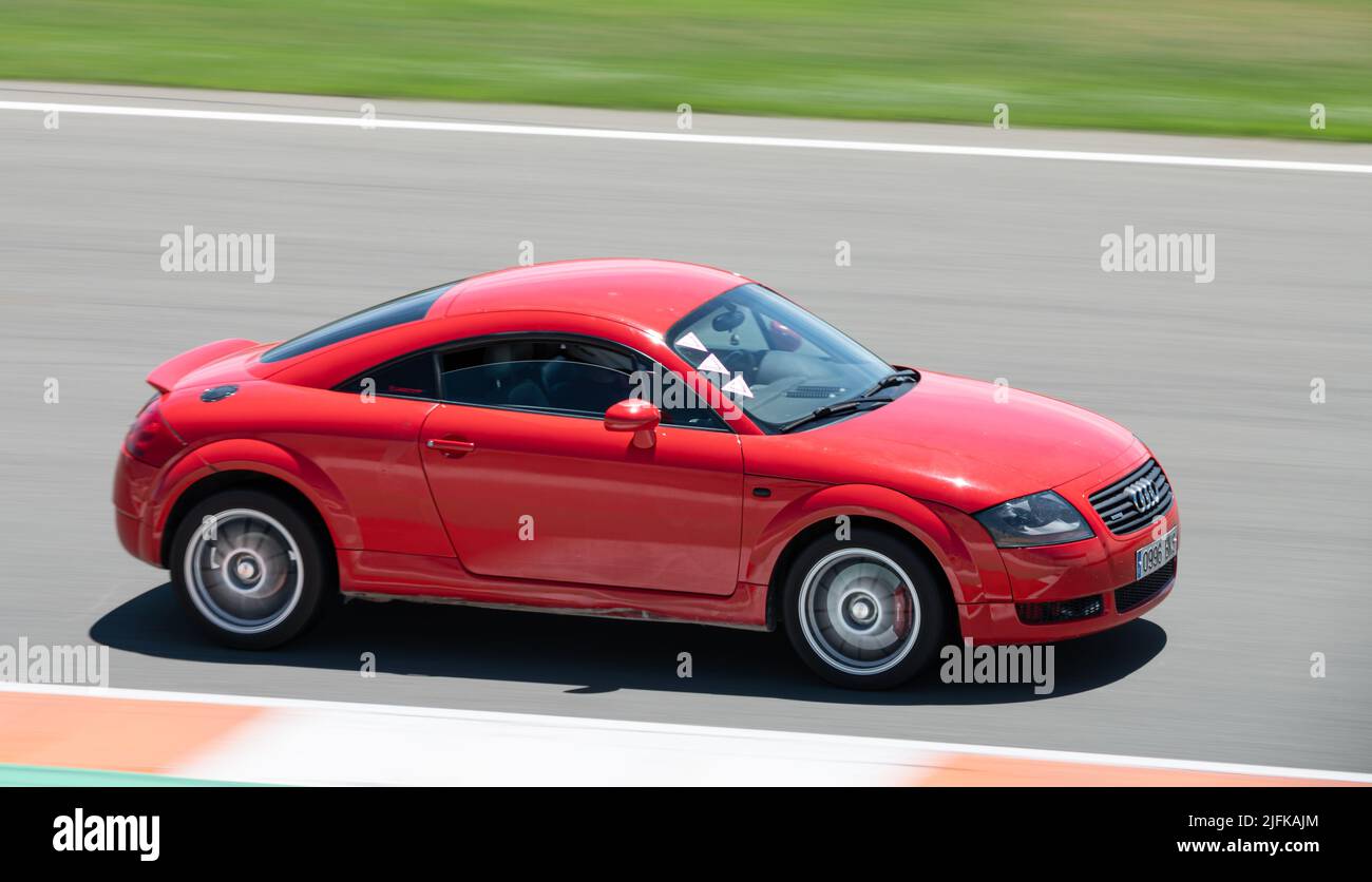 first generation red Audi TT running on the Valencia racing circuit ...