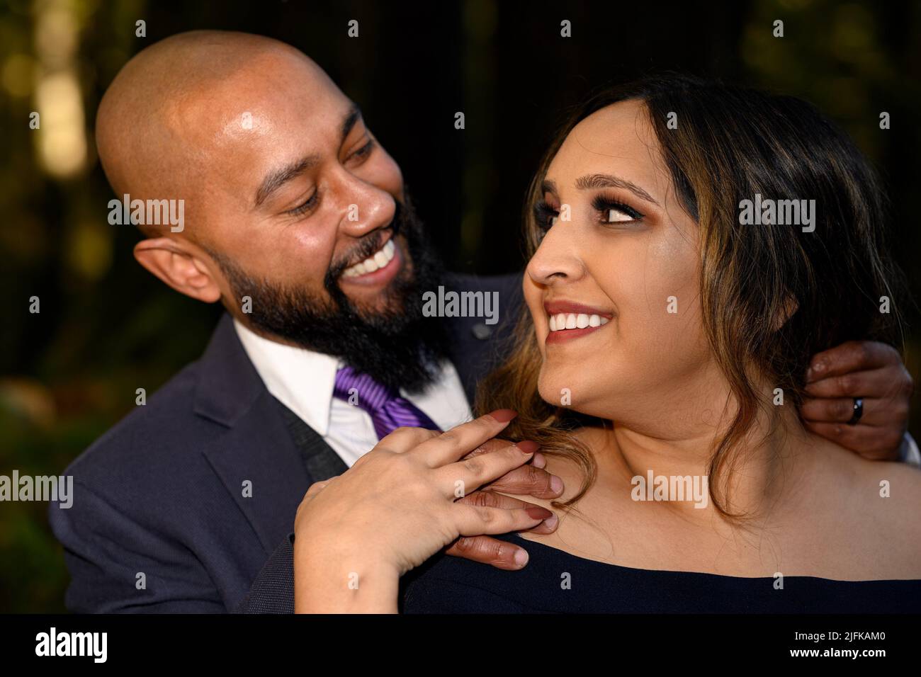 Full of love photo of an affectionate mixed race young couple holding ...
