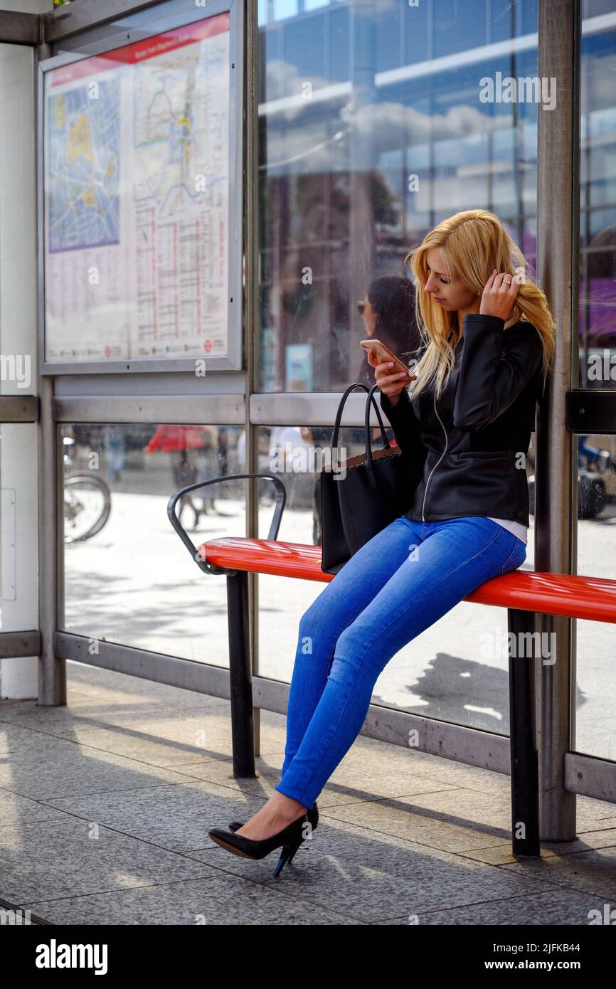 Young woman bus station hi-res stock photography and images - Alamy