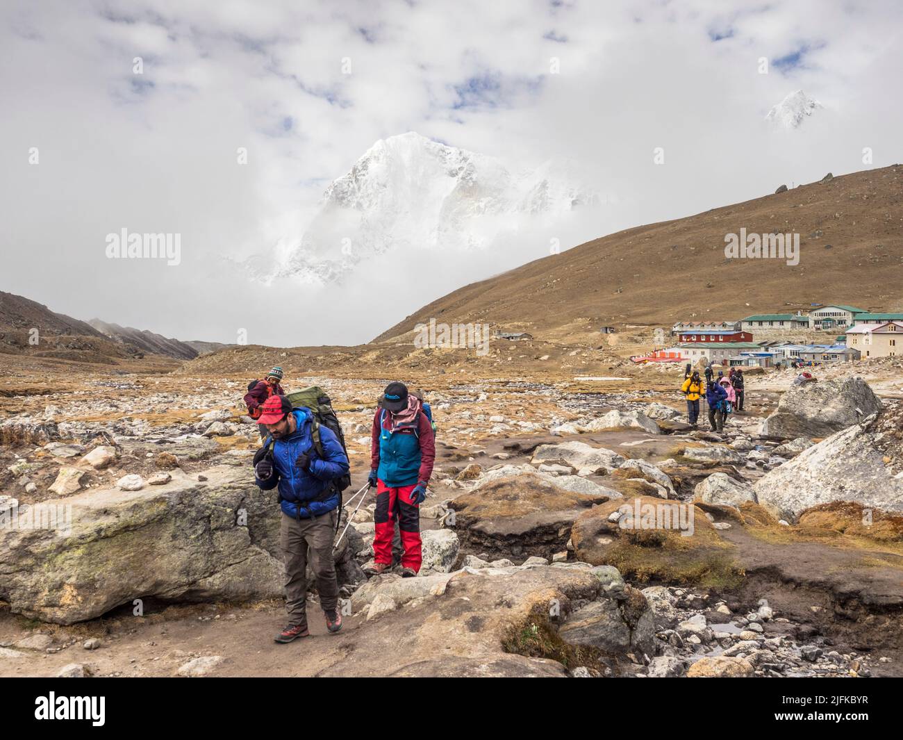 Trekkers and sherpas heading to Everest Base Camp from Lobuche village ...