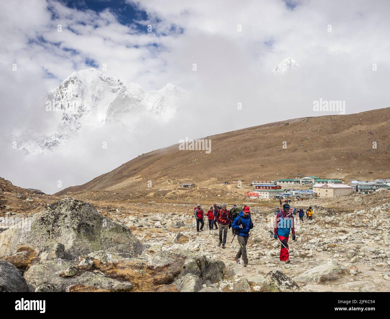 Trekkers and sherpas heading to Everest Base Camp from Lobuche village ...
