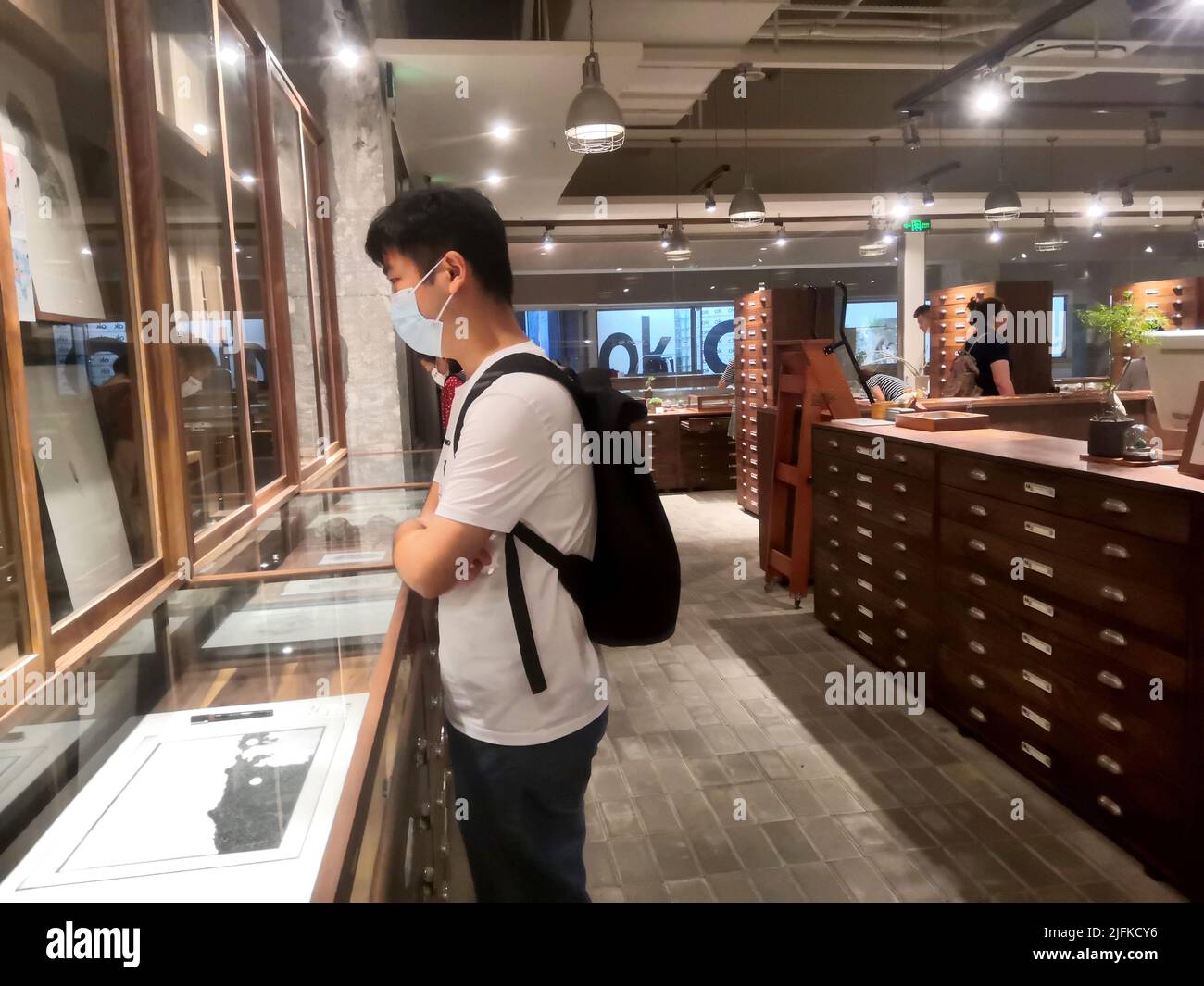 CHENGDU, CHINA - JUNE 30, 2022 - A tourist watches an exhibition at ...
