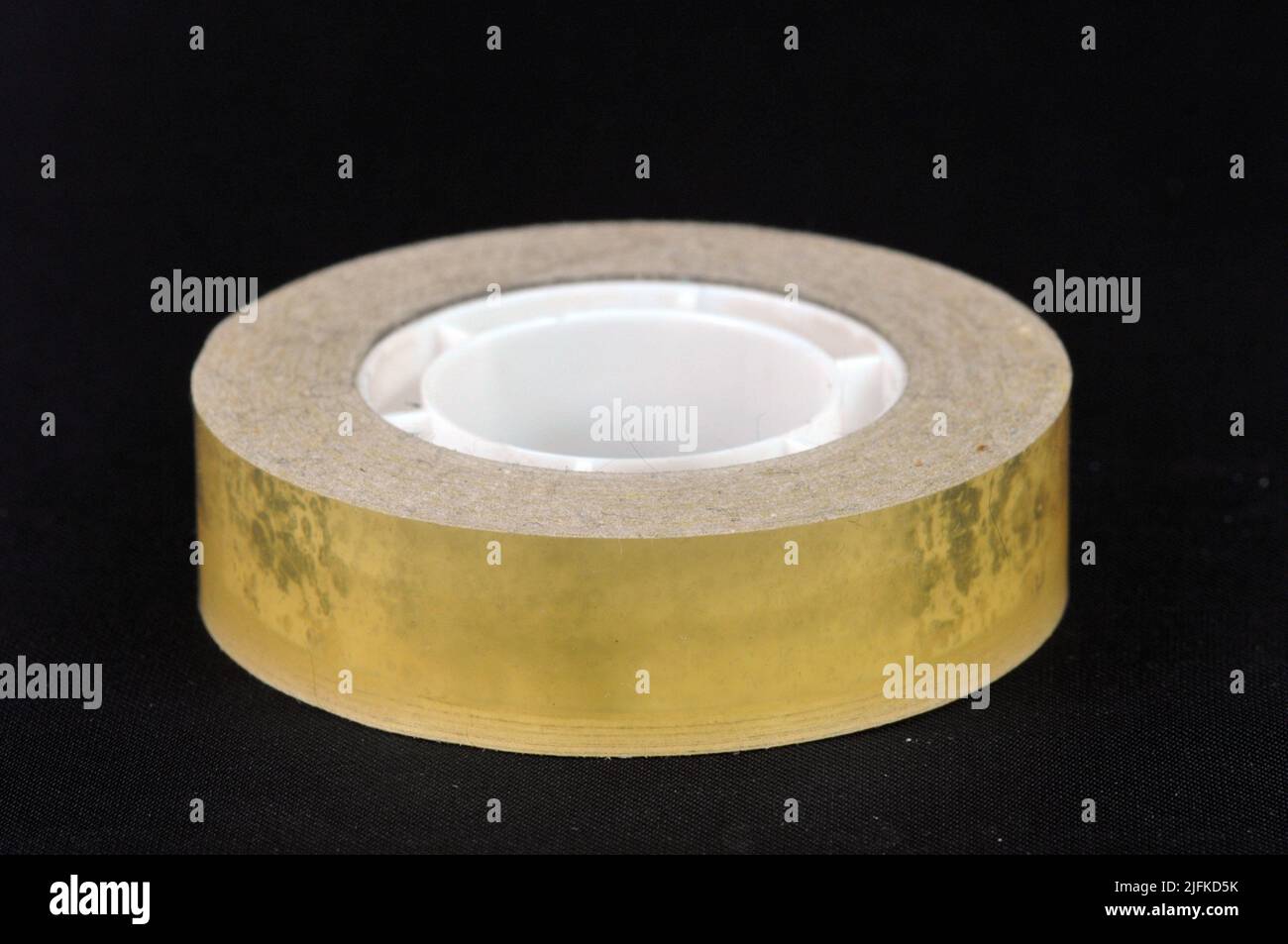 Picture of a tape roll on a dark background Stock Photo - Alamy