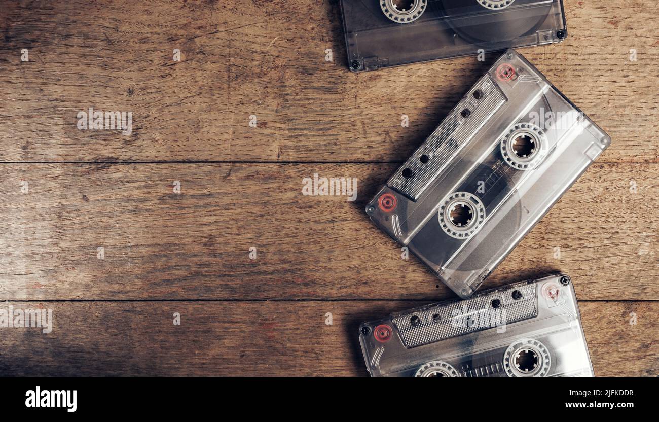 Beautiful Audio cassette tape on a brown old wooden table. Minimalism ...