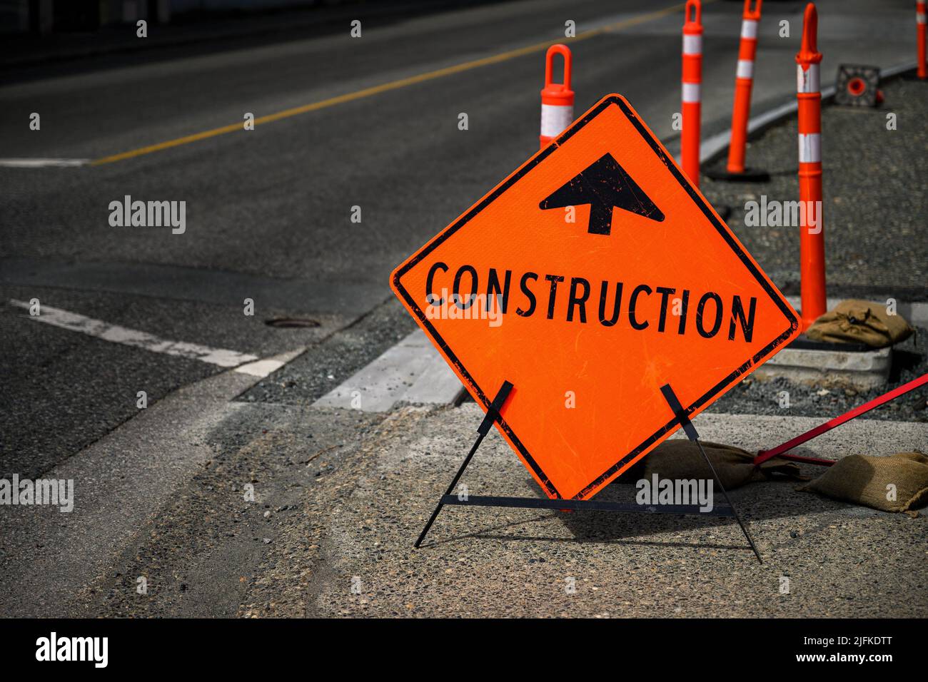 Bright orange road works warning sign hi-res stock photography and ...