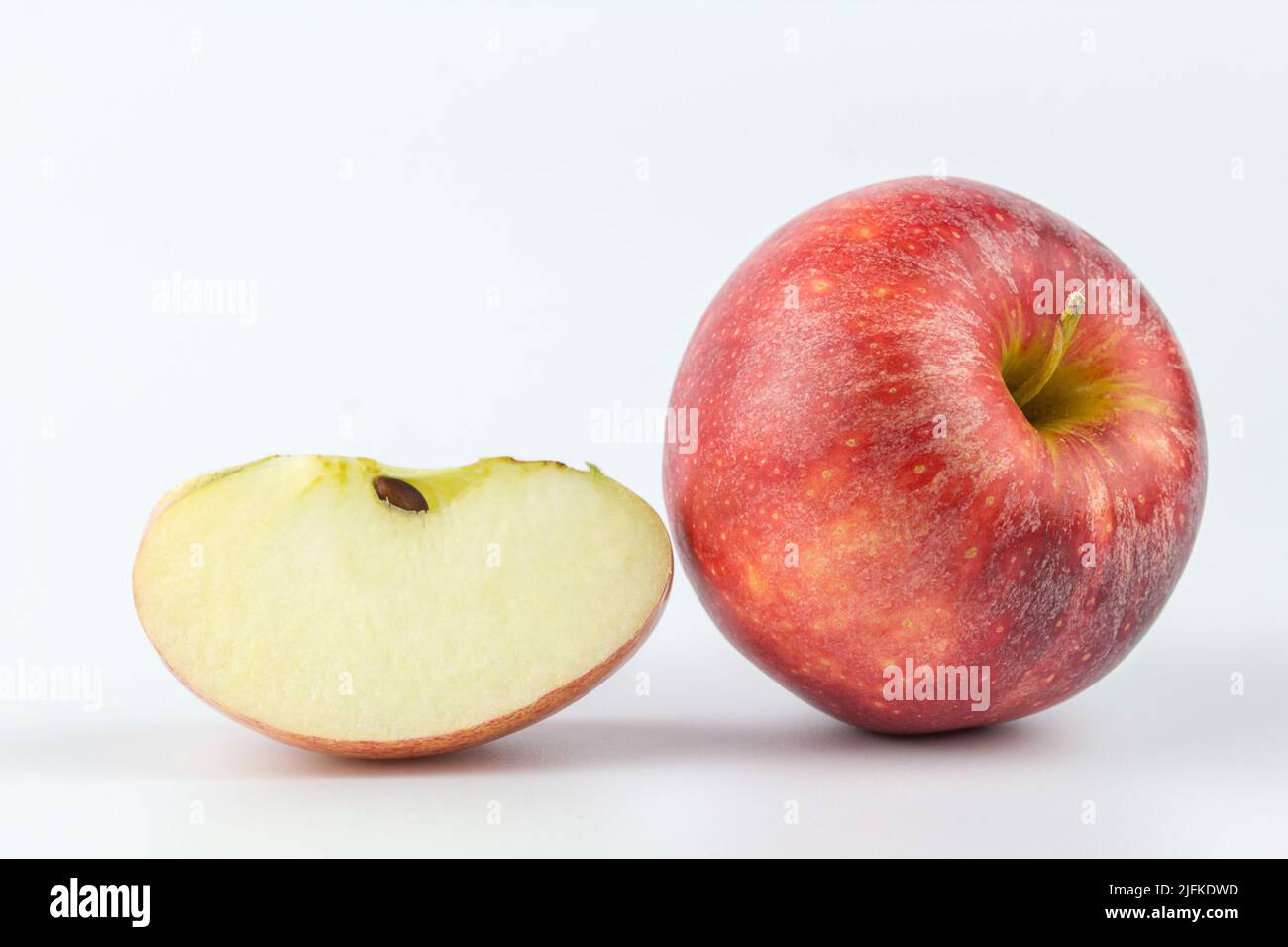 Whole red apple fruit with slice (cut) isolated on white background ...